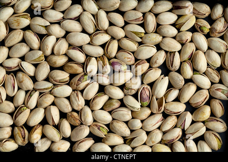 Roasted pistachio nuts in shells. Natural food peanuts stacked background Stock Photo - Alamy