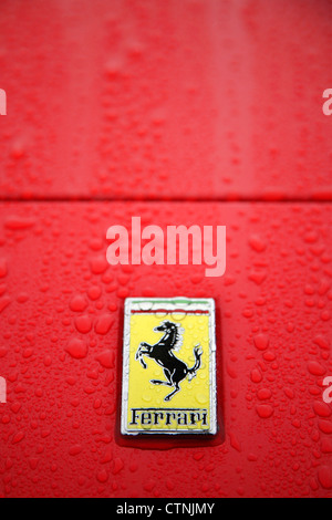 Badge on red Ferrari sportscar Stock Photo - Alamy