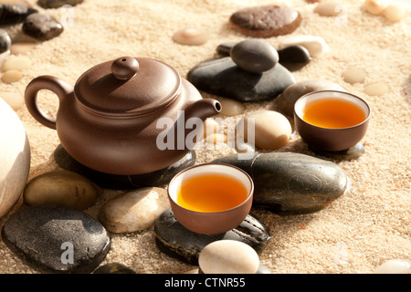 Tea set and pebbles Stock Photo - Alamy