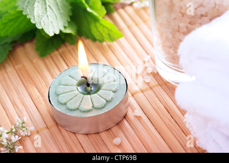 Spa Candles with towel and bath salt Stock Photo - Alamy