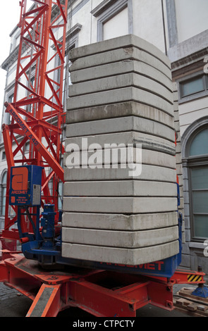 Concrete counterweights at the base of a crane on a construction site ...