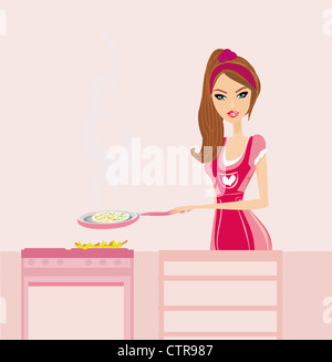Beautiful lady cooking lunch Stock Photo - Alamy
