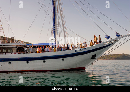 The "Ombak Putih", a traditional Phinisi schooner, anchors off of ...