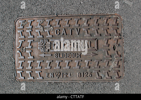 Cable TV (CATV) access cover in pavement, United Kingdom Stock Photo ...