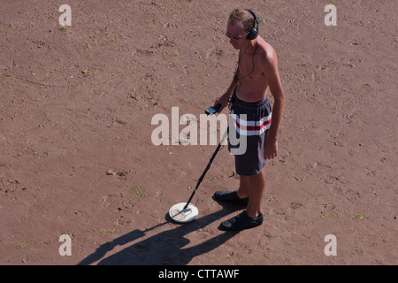 A man Metal detecting on the beach at Instow. North Devon. UK Stock ...