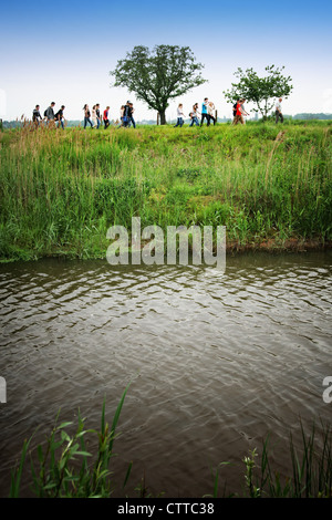 Group of students on excursion tour visit gallery museum with tour ...