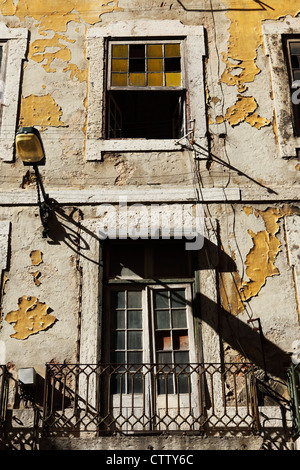 Flaked paint on the facade of a Pombaline style building in the Cais do ...