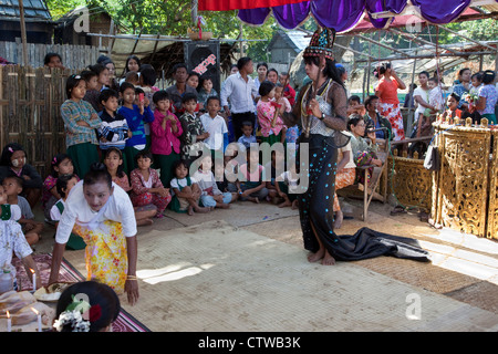 Myanmar, Burma. Bagan. Dancer at a Nat Pwe Celebration, giving thanks ...