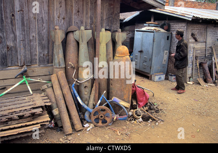 Scrap metal yard with US Vietnam War-era war scrap, cluster bomb ...