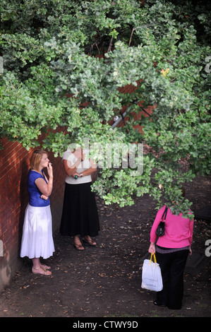 Smokers hiding their cigarettes Stock Photo - Alamy