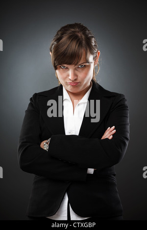 Businesswoman with an expression of distrust, studio shot Stock Photo ...