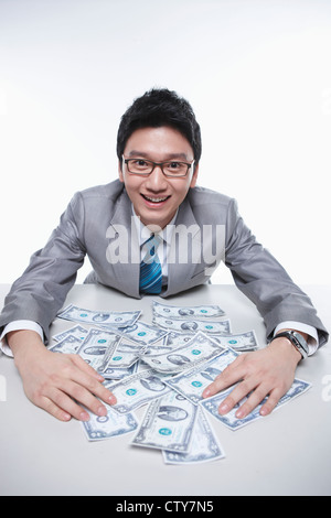 A happy businessman earning the big money Stock Photo - Alamy