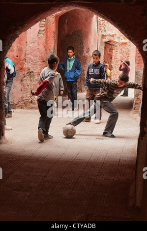 Boys playing with a ball in the medina of Meknes, Morocco Stock Photo ...