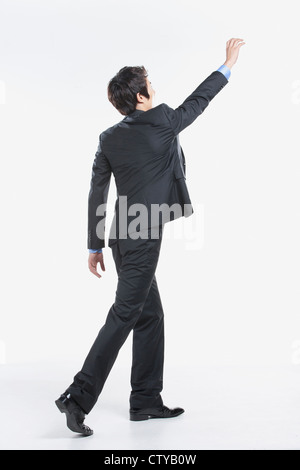 A man trying to catch something Stock Photo - Alamy