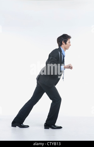 A man pushing something Stock Photo - Alamy