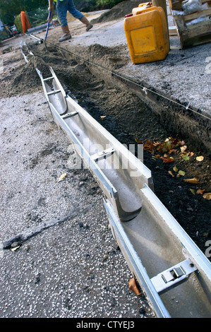 Footing drain pipes installed on pavement Stock Photo - Alamy