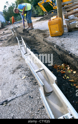 Footing drain pipes installed on pavement Stock Photo - Alamy