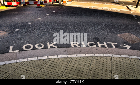 Look right sign on street pavement in London Stock Photo - Alamy