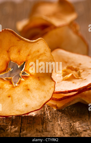 dried apples slices on old wooden table stacked Stock Photo - Alamy