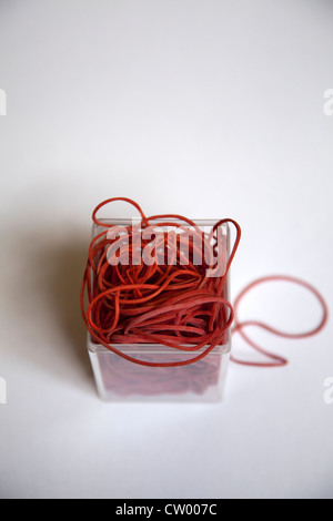 Red Elastic Bands in Container Stock Photo - Alamy