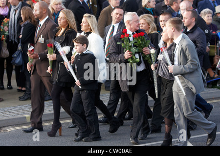 Friends, family & colleagues of L/Cpl Peter Eustace react during a ...