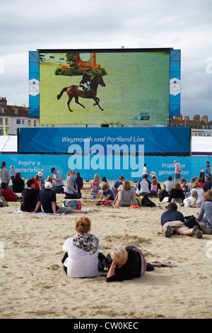 SPECTATORS WATCHING THE BIG TV SCREEN AT THE OLYMPIC GAMES LONDON 2012 ...