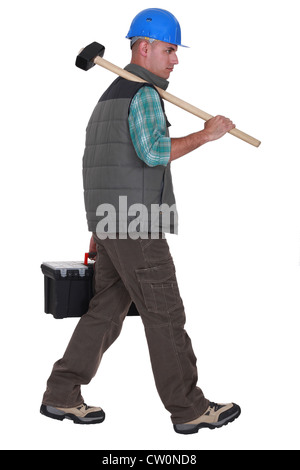 A man carrying a sledgehammer Stock Photo - Alamy