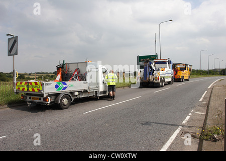 Service vehicles beside a crashed heavy good vehicle Stock Photo - Alamy