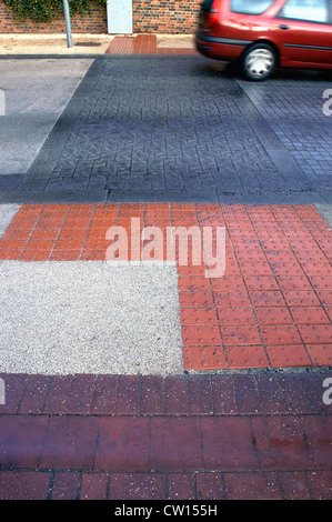 Road marking with feature for blind people at pedestrian crossing. UK ...