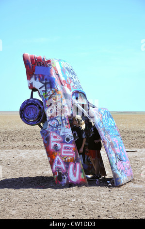 Child painting cars Cadillac Ranch Amirillo Texas Stock Photo: 12777213 ...