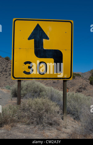 Sharp turn of road. Sharp turn sign. Highway infrastructure. Red road ...