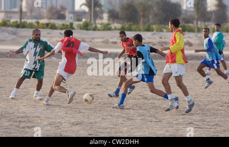 Dubai, men playing football Stock Photo - Alamy