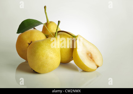 Fresh ripe pears on light background Stock Photo - Alamy