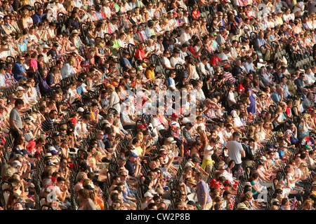 Crowds in the stands of Olympic Stadium, with runners on the starting ...