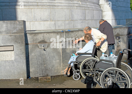 Collecting Lourdes spring water from the Sanctuary of our Lady of ...