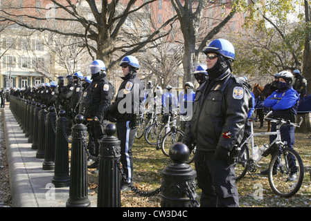 U.S. Park Police stand guard near a security fence along the Lincoln ...