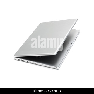 A laptop computer with a half-open screen on a dark background. Copy ...