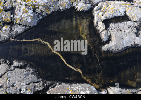 Rock pool with a white vain running through black stone, Lettermullan ...