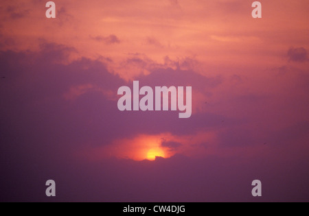 Sun Setting Through Clouds Florida Keys Stock Photo - Alamy