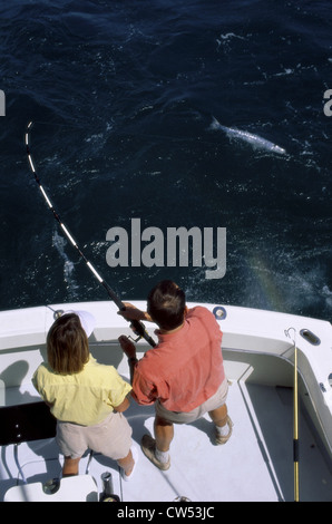 High angle view of a mid adult woman standing at the poolside Stock ...