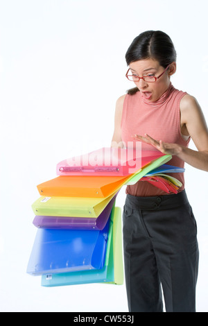 Stack of ring binders falling from a businesswoman's hands Stock Photo ...