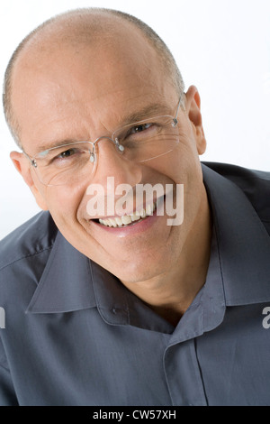 Portrait of smiling businessman Stock Photo - Alamy