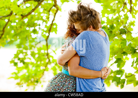 Romatic couple embracing outside Stock Photo - Alamy