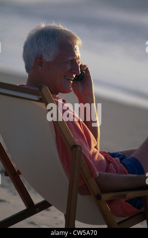 Smile, phone and senior man in home for email notification, text ...