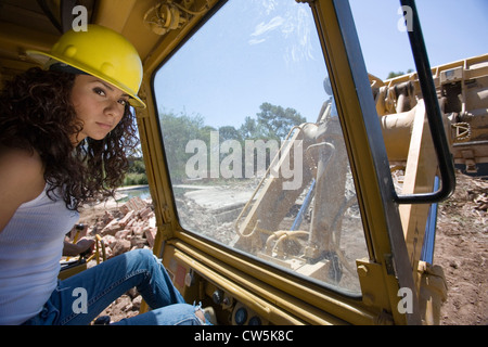 Woman operating bulldozer at a construction site Stock Photo - Alamy