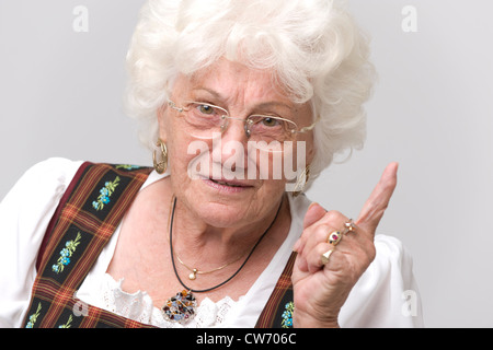 An angry senior woman, wagging her finger and scolding Stock Photo - Alamy