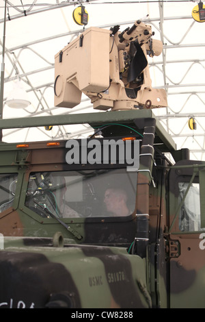 A tactical operator equipped with advanced night vision gear and ...