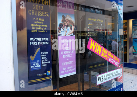 Travel agent window display holiday offers deals Stock Photo - Alamy