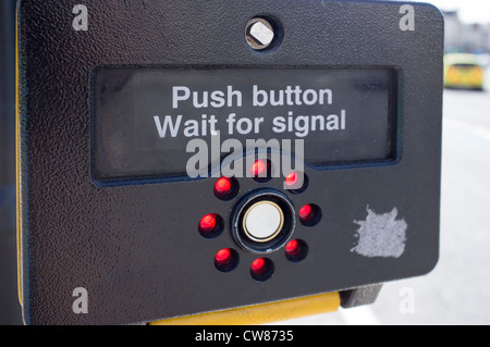 push button wait for signal pedestrian crossing button on a street in ...