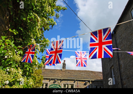 Small British Union Jack celebration flags against a blue sky Stock ...